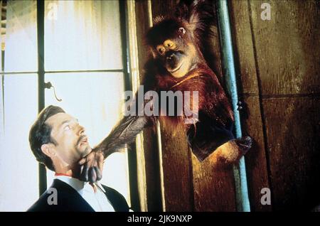 DUNSTON CHECKS IN, Rupert Everett, 1996 Stock Photo - Alamy