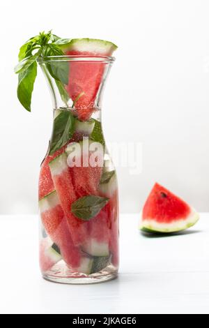 Watermelon infused water on white background Stock Photo - Alamy