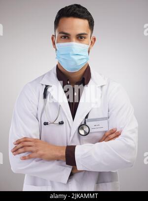 Handsome hispanic doctor man wearing stethoscope at the clinic smiling ...