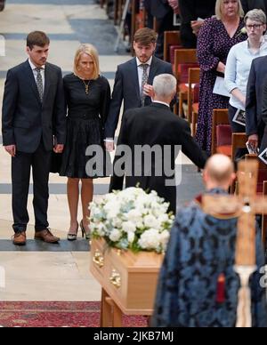 Harry Gration's widow Helen Chene and their son Harvey (left) walk ...