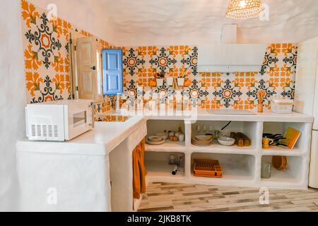Modern kitchen inside a troglodyte cave for rural tourism Stock Photo ...