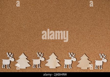 Cork background. Reindeer and Christmas tree copy space border. Place ...