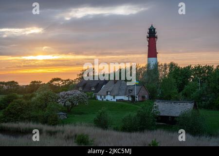 Panoramic image of Pellworm lighthouse against sunrise, North Frisia ...