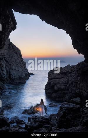 Woman standing near coast wearing swimming cap Stock Photo - Alamy