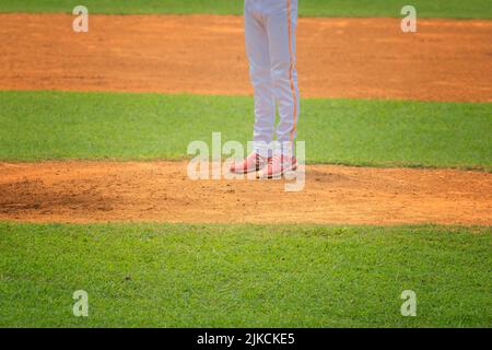 a view of a baseball player's legs Stock Photo - Alamy