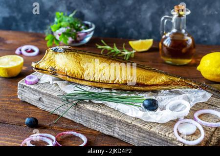 Smoked mackerel on wooden background Stock Photo - Alamy