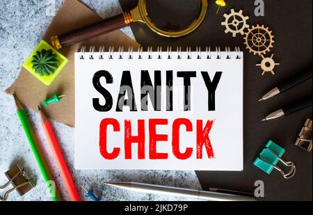 text Sanity check on white business card Stock Photo - Alamy