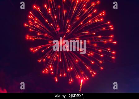 Bright, beautiful red fireworks in the night sky. High quality photo ...