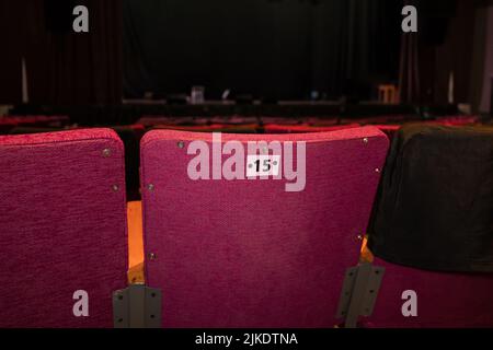 a view of theater seats with rear numbers and an empty stage Stock ...