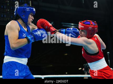 England's Gemma Paige Richardson (red) and Scotland's Megan Reid in the ...