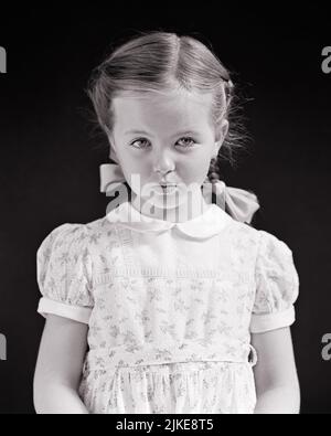 Half-length portrait of charming emotional little girl expressing ...