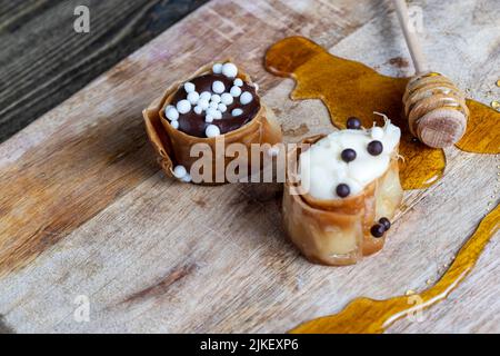 sweets made of thin puff pastry with chocolate filling and honey ...