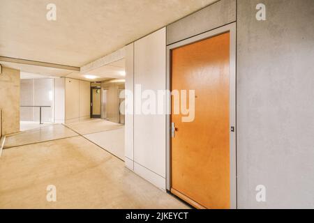 Shiny elevator in illuminated hall of contemporary apartment building ...