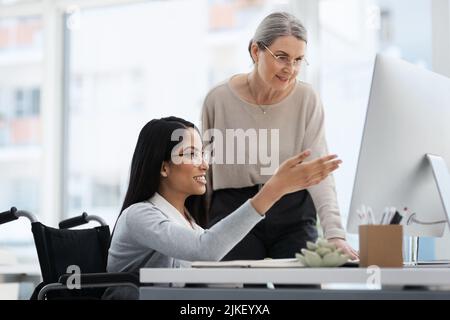 I need your opinion on this. two young businesspeople standing together ...