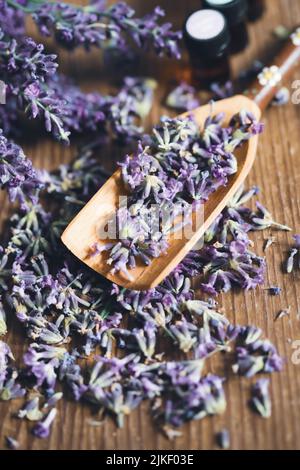 Beautiful lavender flowers and scoop on color background Stock Photo ...