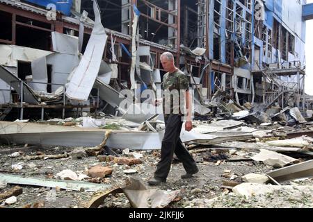 MEREFA, UKRAINE - AUGUST 1, 202 - An industrial enterprise shows damage ...