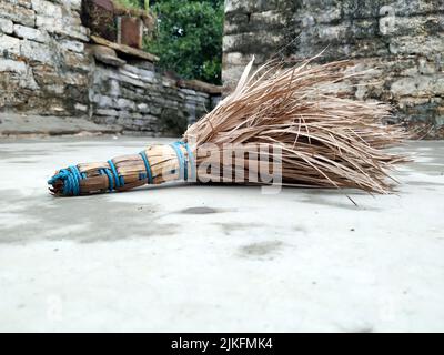 brown brooms put on the ground Stock Photo - Alamy
