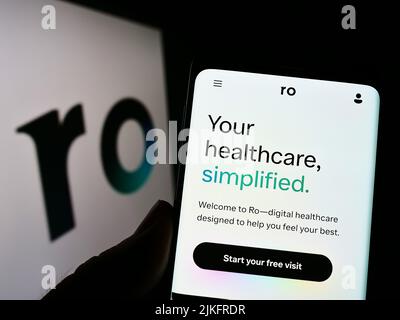 Smartphone with website of telehealth company Roman Health Ventures Inc ...