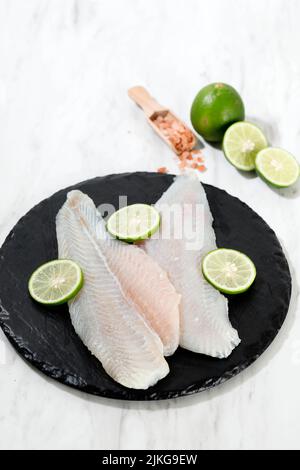 fresh fillet dory on a white background Stock Photo - Alamy