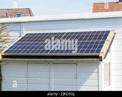 Mini photovoltaic system on a garden shed. Electricity self-sufficiency ...