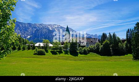 a scenic view of the Elmau Schloss Hotel in the german Alps (Germany ...