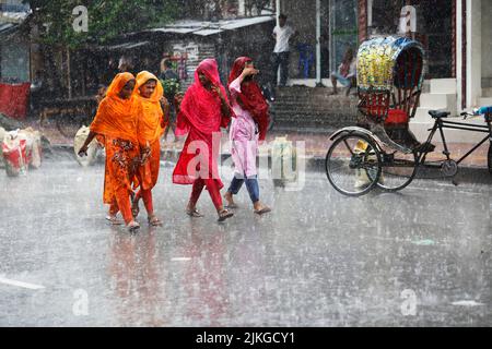 Dhaka, Bangladesh - August 02, 2022: People walk through the Mugda para ...