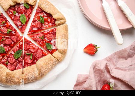 Cut strawberry galette on light background, closeup Stock Photo - Alamy