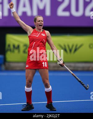 England's Giselle Ansley (centre) celebrates scoring the first goal ...
