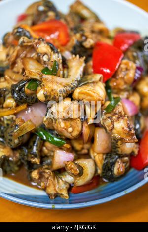 A delicious Chinese dish, fried bullfrog in sauce Stock Photo - Alamy