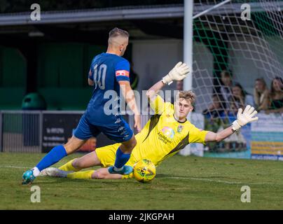 Football striker player with yellow team suit jumps Stock Photo - Alamy