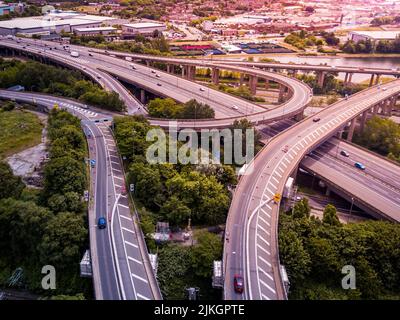 An aerial view of a complex motorway road junction with traffic Stock ...