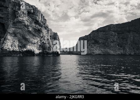 A grayscale shot of a huge cliffs in Sardinia, Italy Stock Photo - Alamy