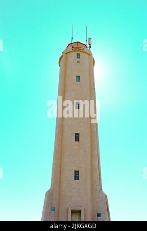 A vertical shot of an old, tall lighthouse in Cannes, France, in sunny ...