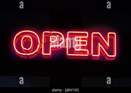 Open neon sign against dark background showing open for business Stock ...