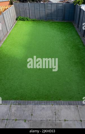 artificial turf lawn covered back garden - uk Stock Photo - Alamy