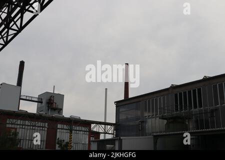 an old industrial warehouse surrounded by infrastructure Stock Photo ...