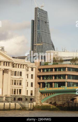 A vertical shot of buildings in London visible from the gap between two ...