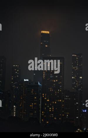 A vertical shot of modern buildings on a cloudy day Stock Photo - Alamy