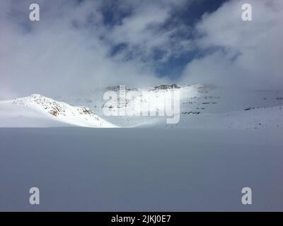A low angle shot of clouds floating near the Himalayas mountains Stock ...