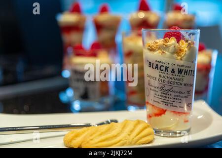 Whiskey shots in glasses with Scottish Shortbread and strawberry cream ...