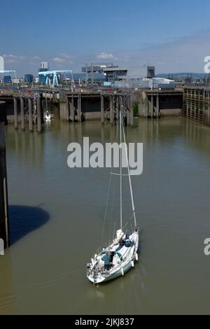Yacht approaching sea lock on Cardiff Bay Barrage, South Wales, UK ...