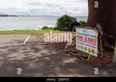 A closeup shot of a sign of the pool closed for maintenance and ...