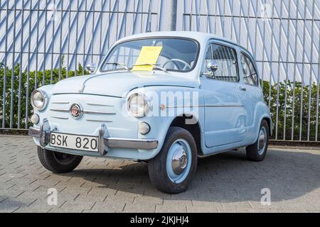 A front shot of a blue Fiat 600,old-timer Italian city car from 1960s ...