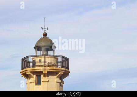 The Lighthouse of El Grao in Castellon, Spain surrounded by water Stock ...
