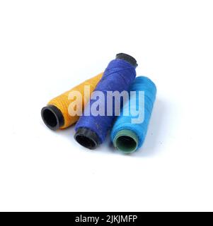 spool of grey thread isolated on white background Stock Photo - Alamy