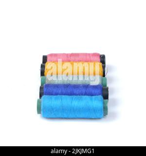 spool of grey thread isolated on white background Stock Photo - Alamy