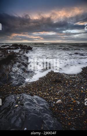 A beautiful shot of waves splashing on the rocks of a the coast Stock ...