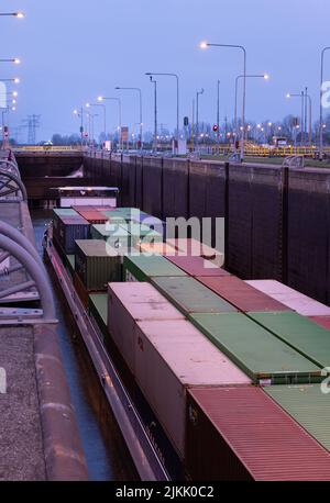 A vertical shot of sluice gates in the Netherlands with a big canal ...