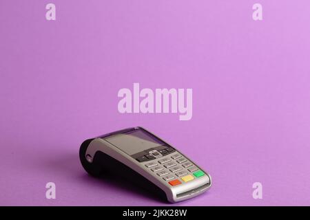 A closeup shot of the POS terminal credit card machines and plant on a ...