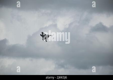 A low angle shot of a stealth aircraft Lockheed Martin F-22 Raptor ...